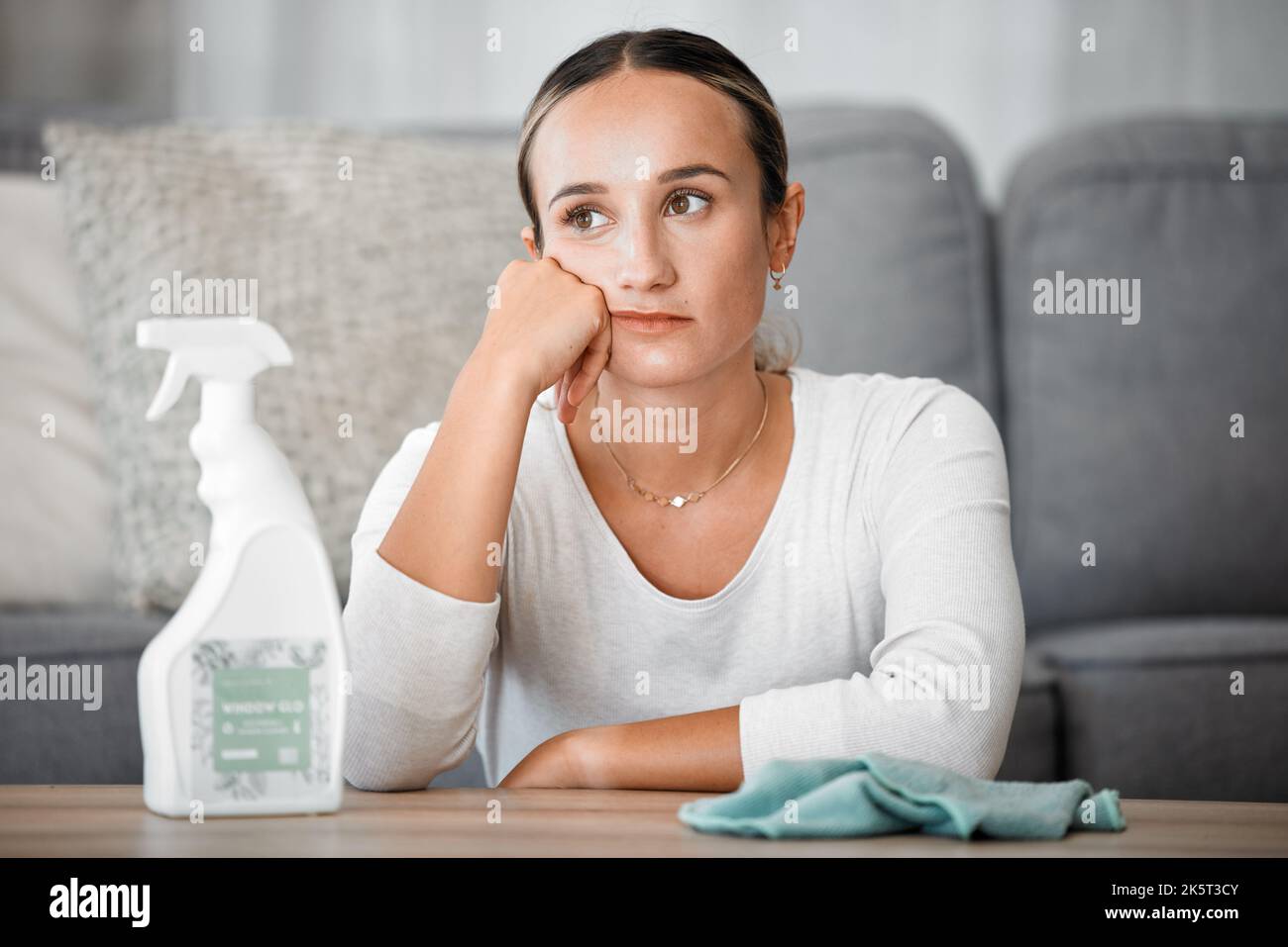 Cleaning, tired and bored with a woman cleaner thinking while in her ...