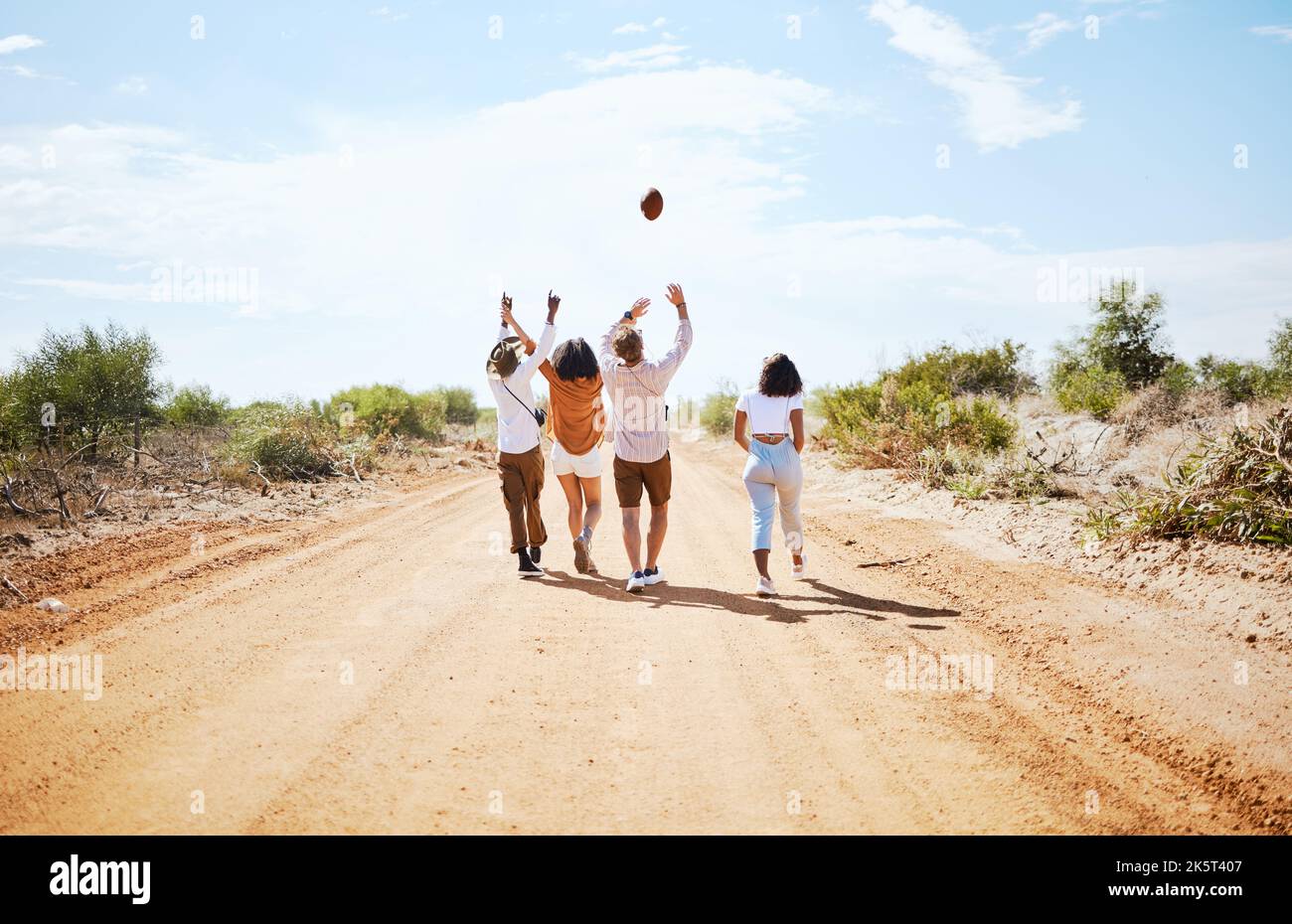 Summer, adventure and friends walking on dirt road in the country ...