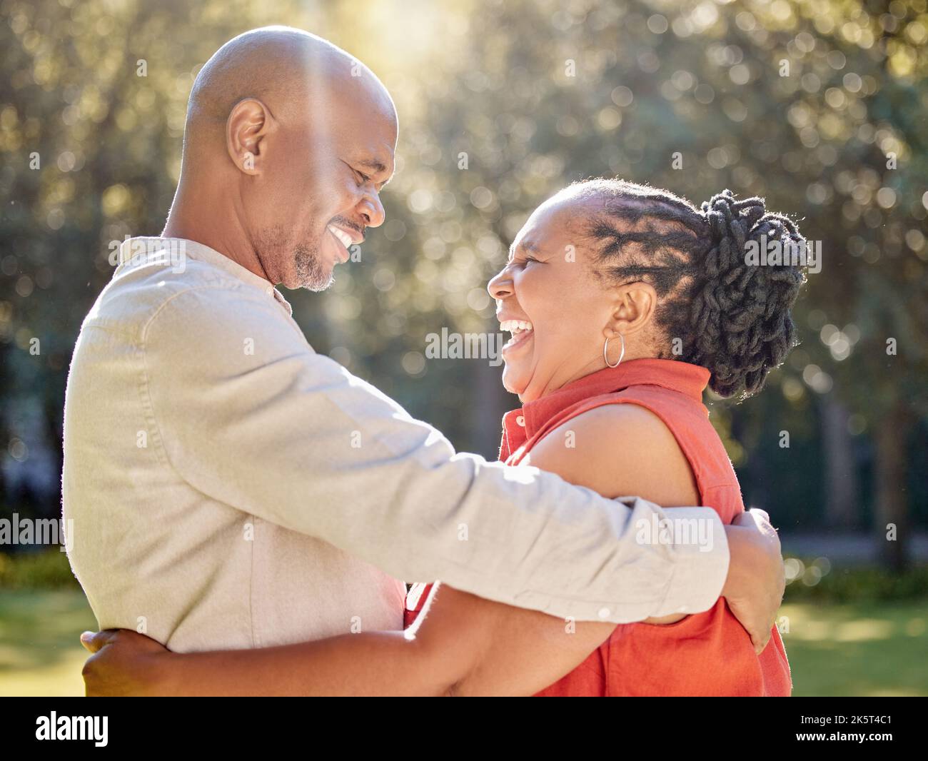 Happy affectionate mature african american couple sharing an intimate ...