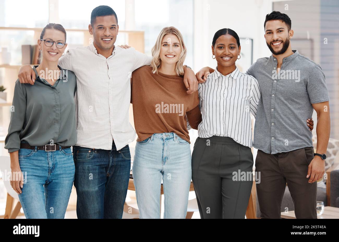 Office staff group hug hi-res stock photography and images - Alamy