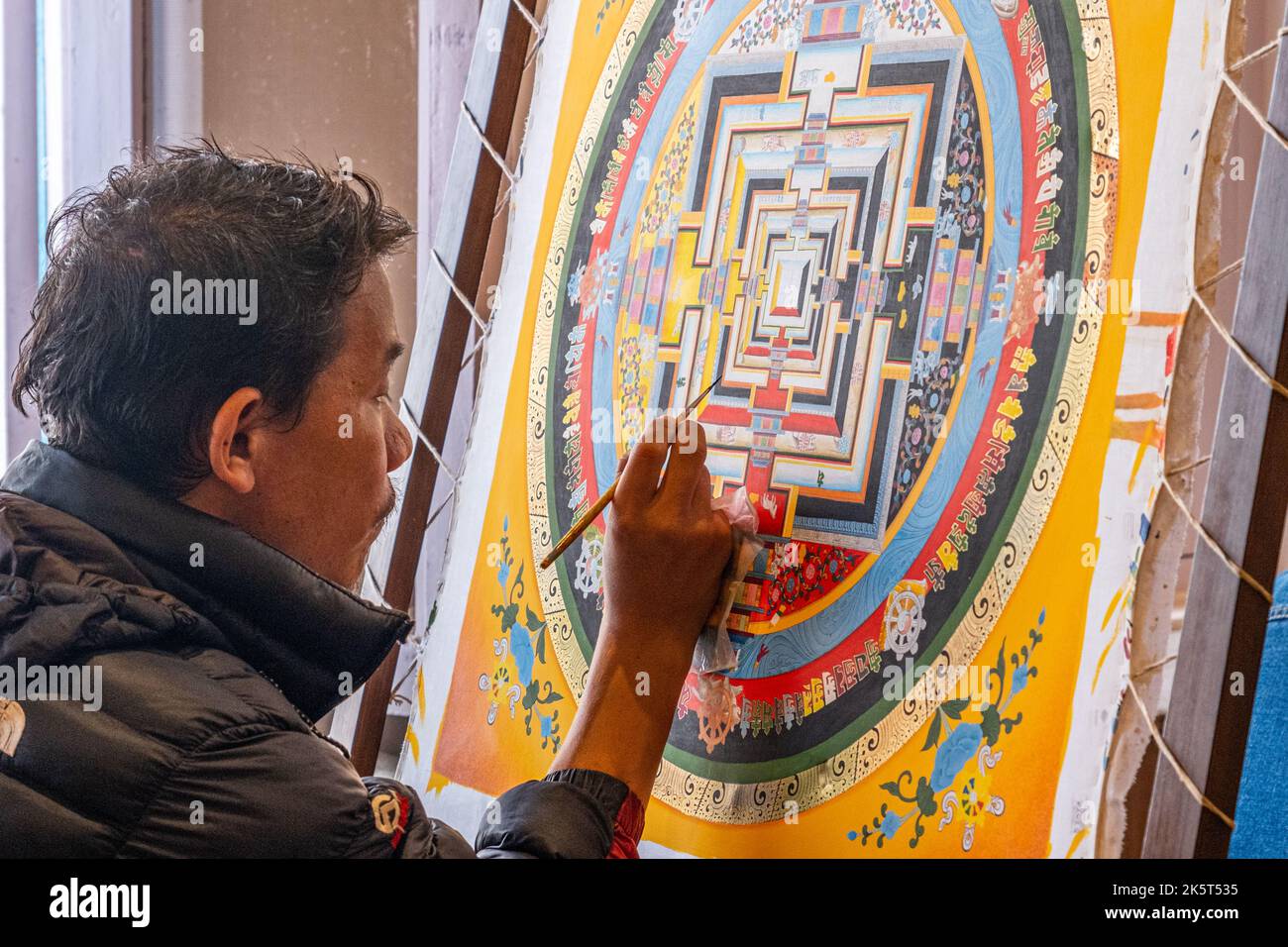 Artist painting Kalachakra Mandala Thangk in Kathmandu Nepal Stock ...