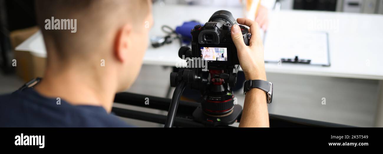Blogger shooting video on professional camera in studio closeup Stock ...