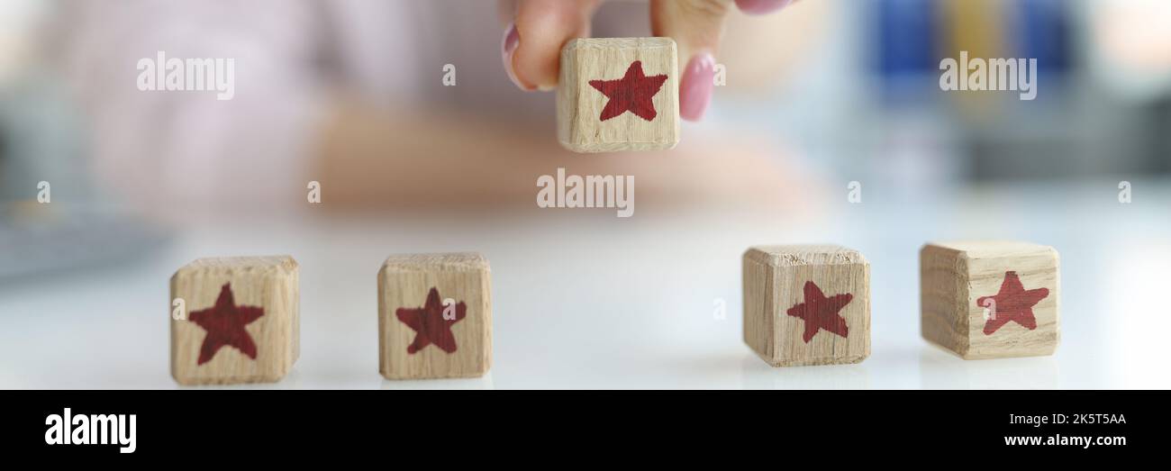 Client putting fifth star for quality service closeup Stock Photo - Alamy