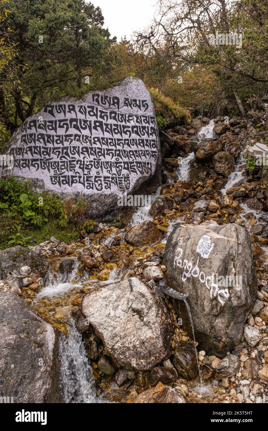 Prayer Stone Everest Way near to waterfall Stock Photo - Alamy