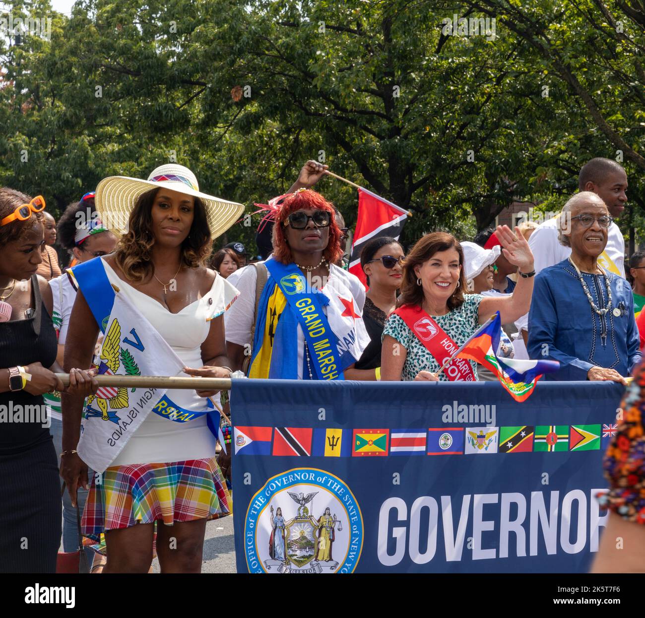 A closeup of Al Sharpton, Kathy Hochul, and Stacey E Plaskett at the ...