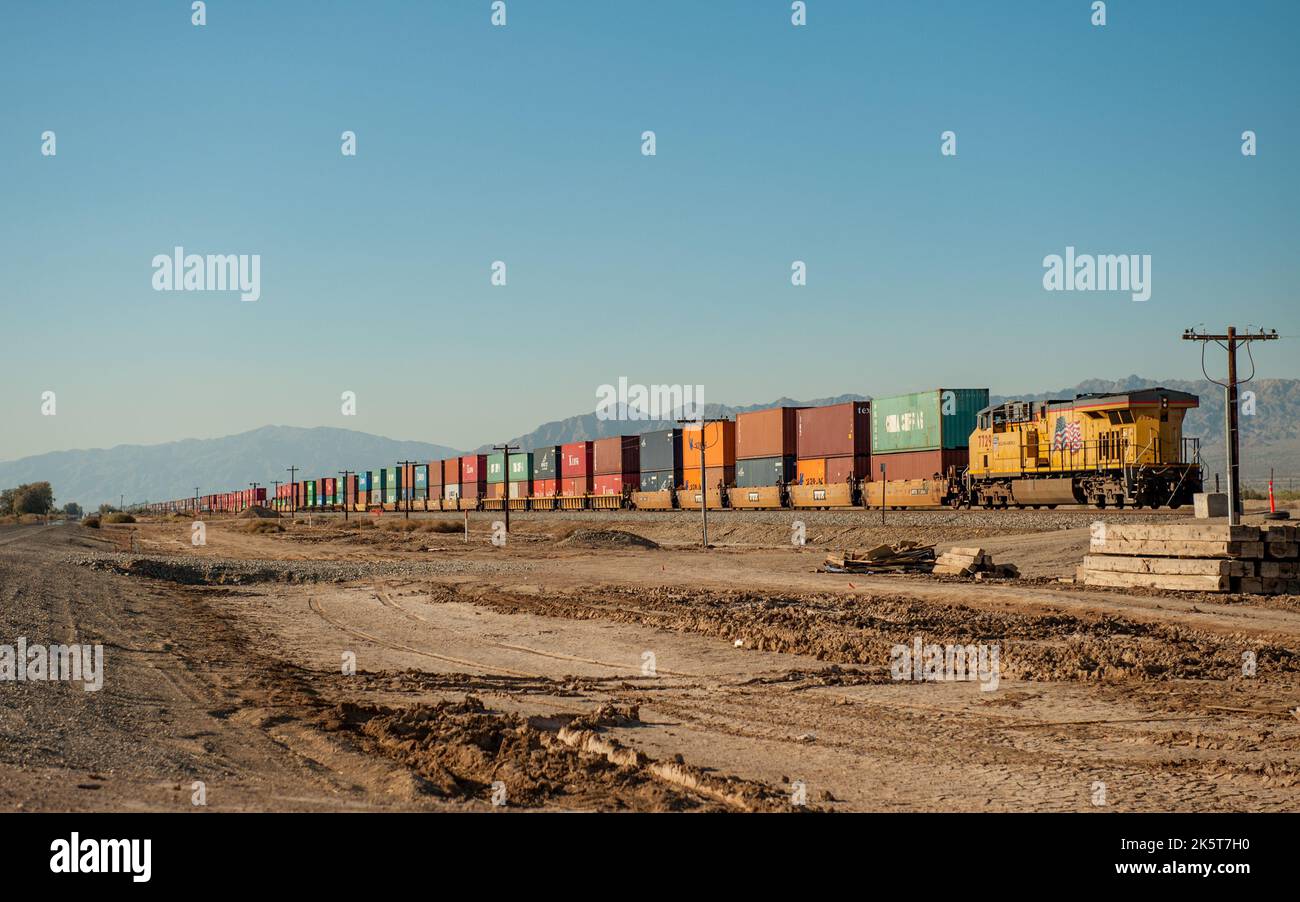 Long cargo train running through the desert in Southern California ...