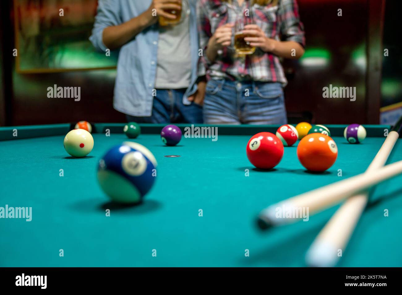 Preparing to break spheres into the pool pocket. People billiard ...