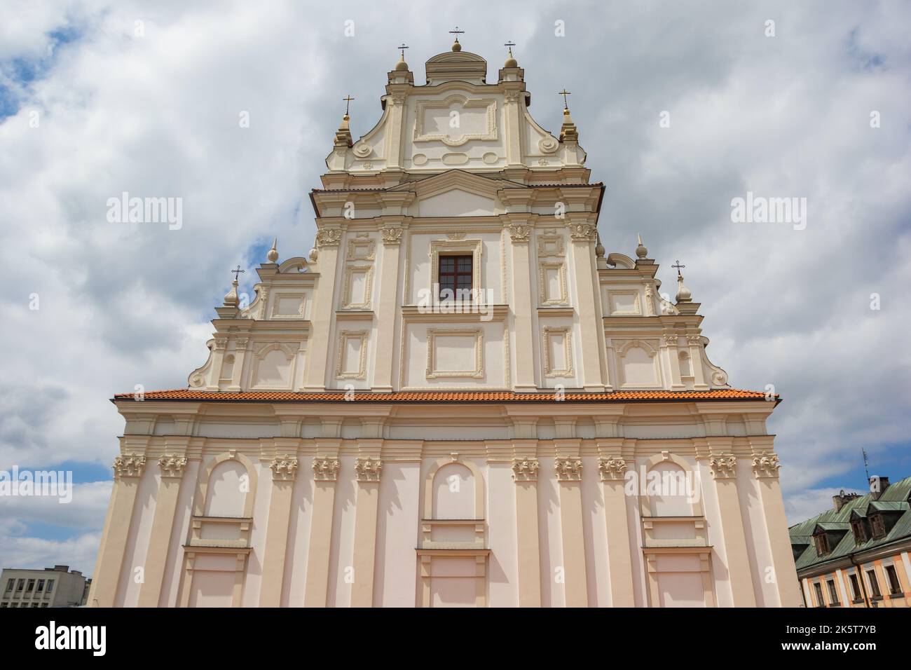 Facade of a famous church in historic city Zamosc, Poland Stock Photo ...