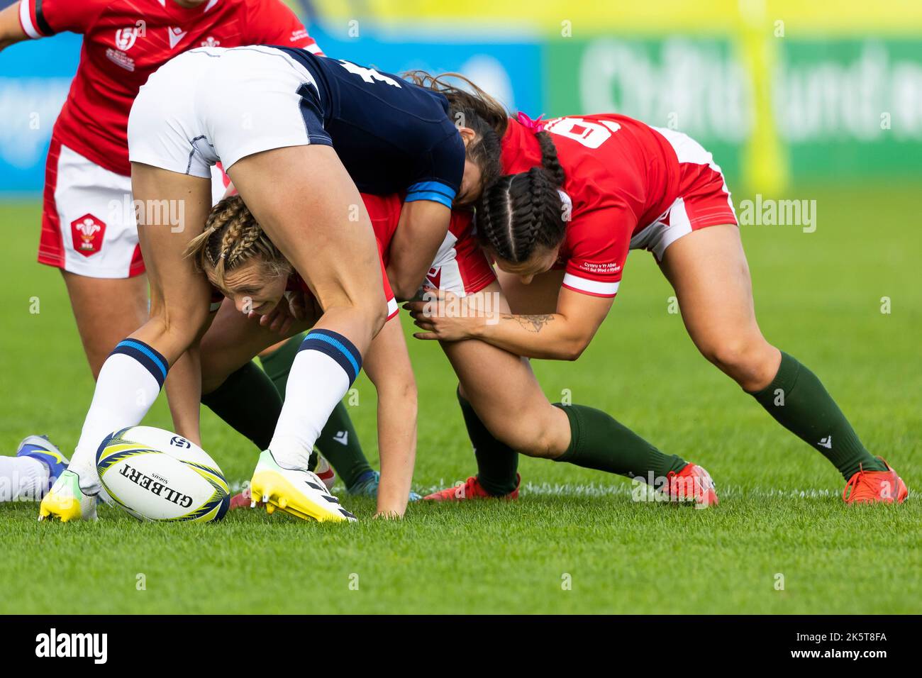 Scotland's Rhona Lloyd competes with Wales players Hannah Jones and ...