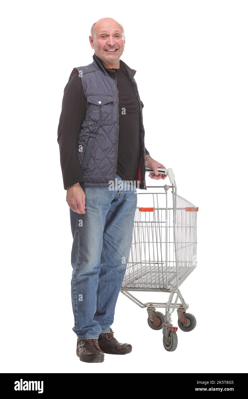 Elderly man pushing a shopping cart isolated on white background Stock ...