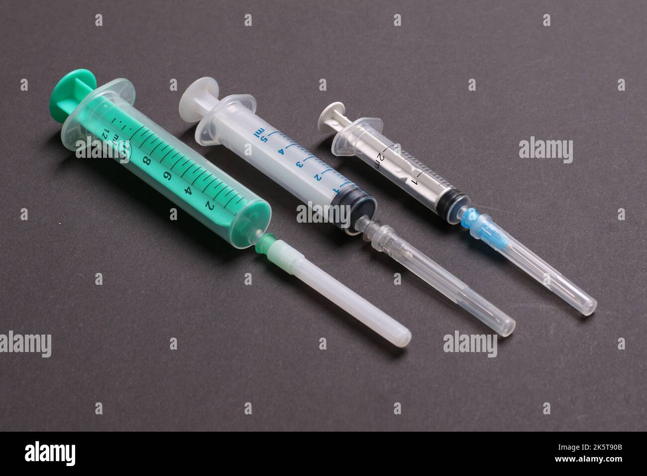 Top view of syringes in a row for medical injection on colorful ...