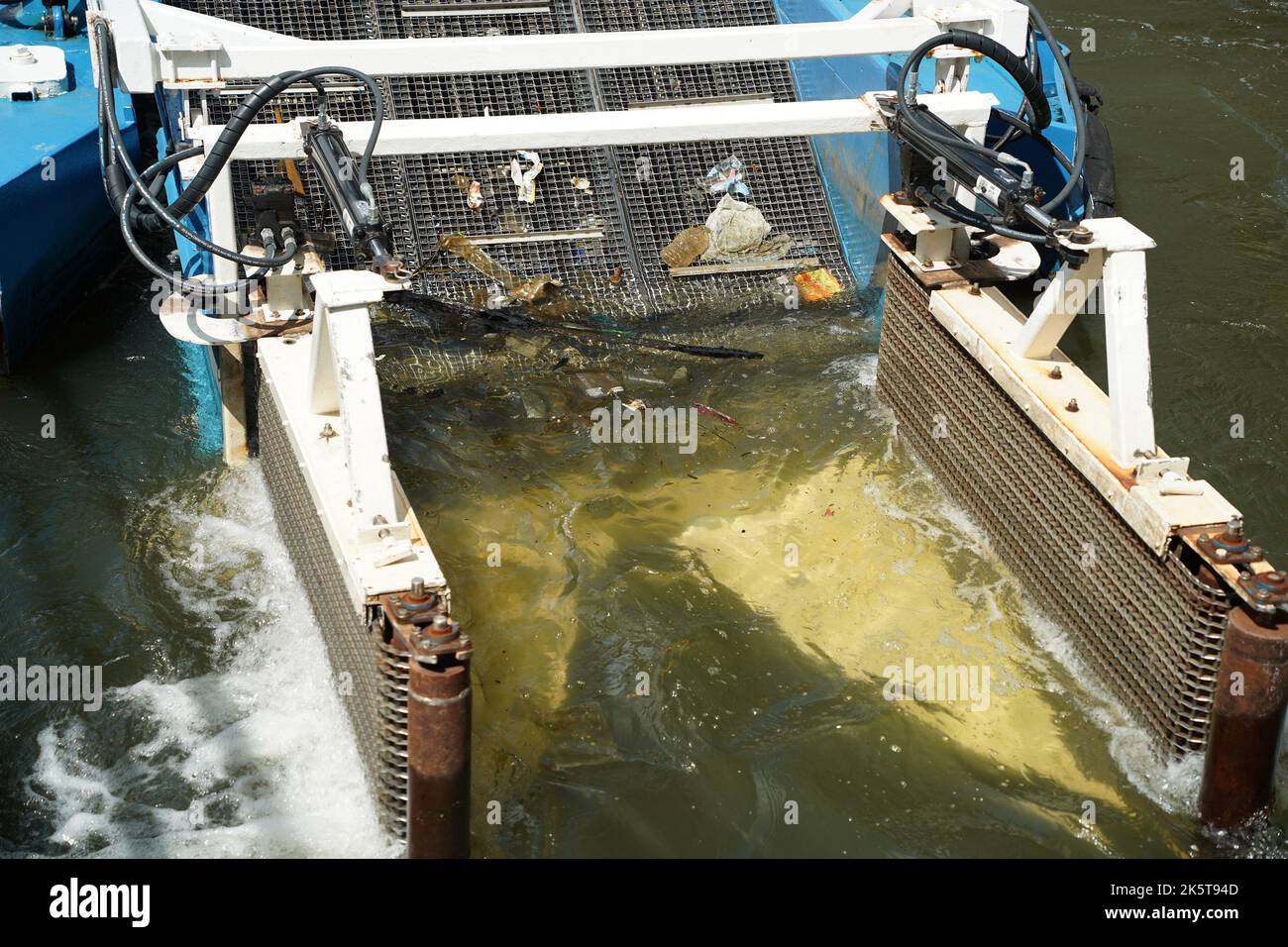 garbage plastic rubbish water sea cleaner boat floating machine Stock ...