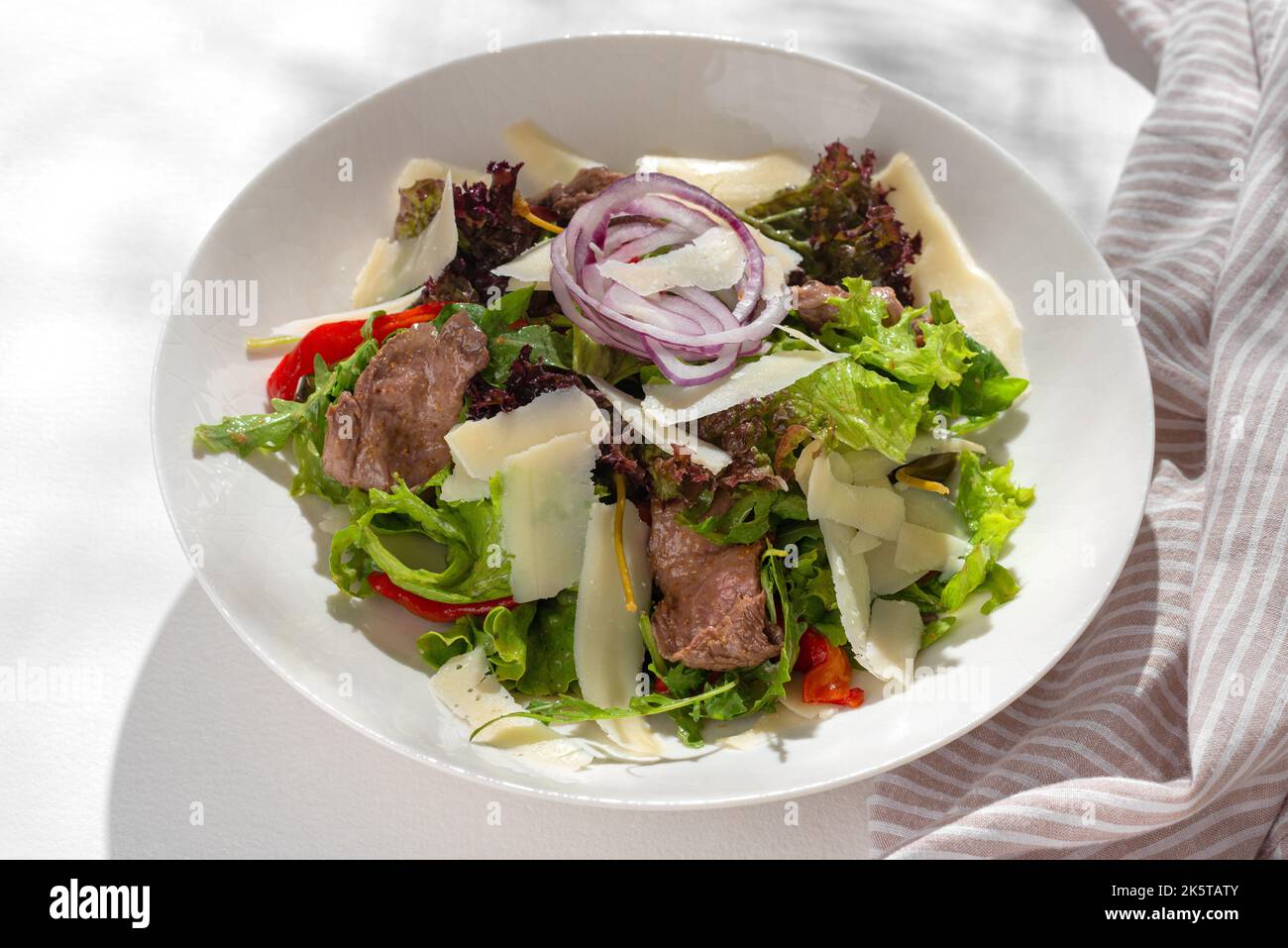 Roast beef salad, capers, bell pepper, Parmesan on white background for ...