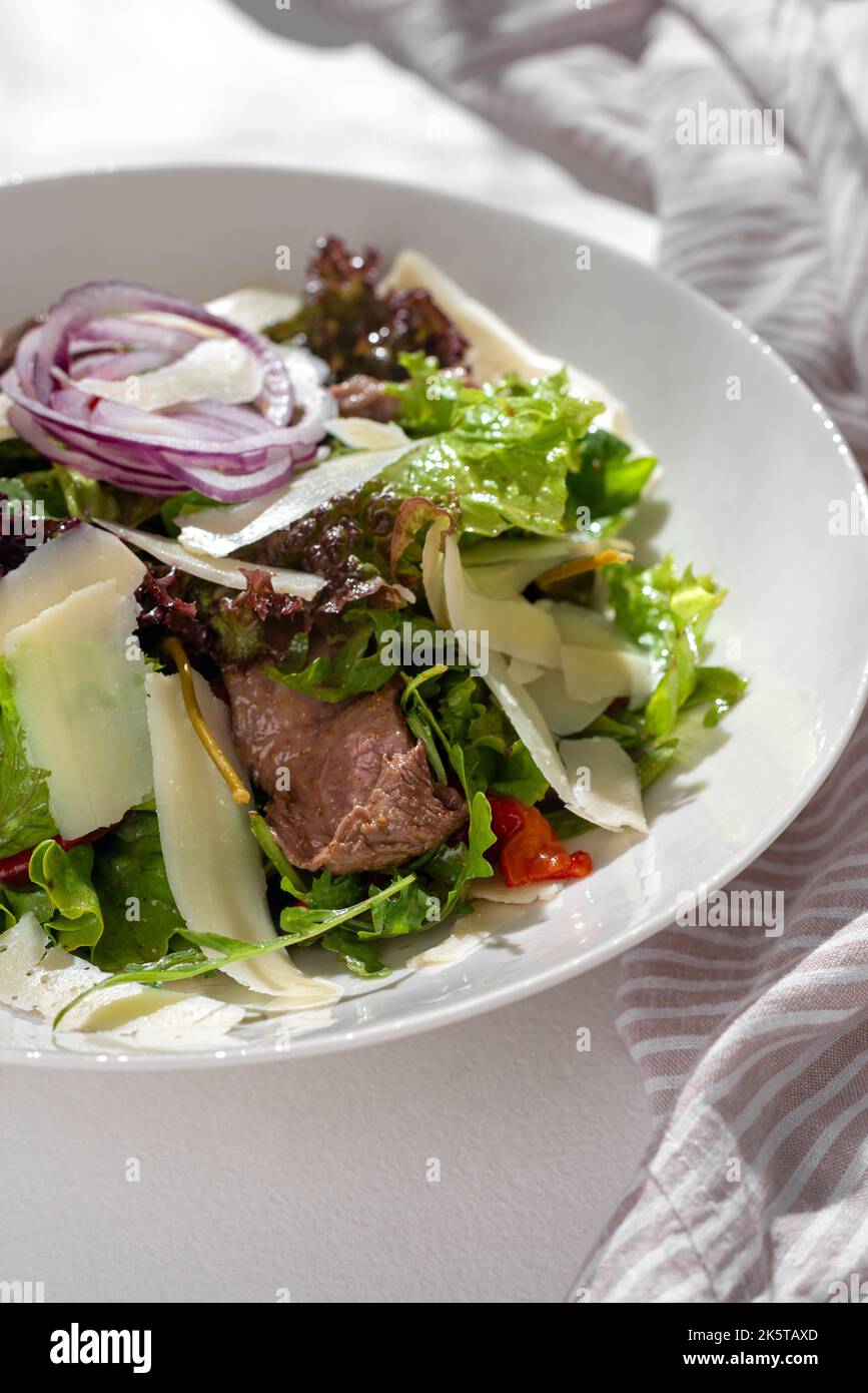 Roast beef salad, capers, bell pepper, Parmesan on white background for ...