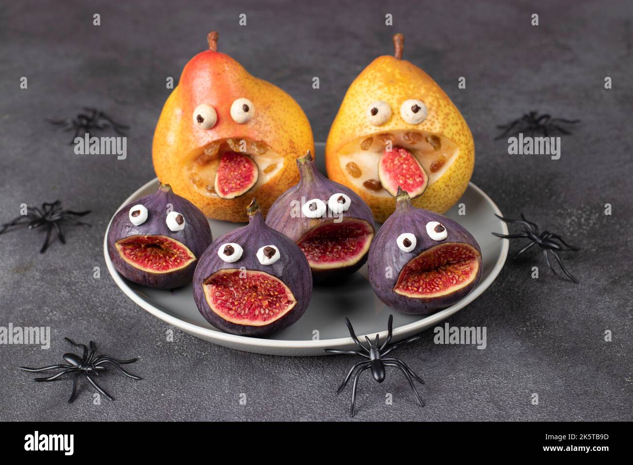 Spooky pear and fig monsters for Halloween party on gray background ...