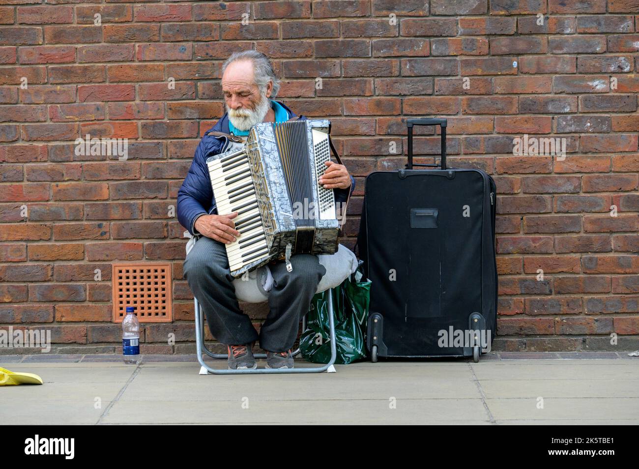 Man musician playing accordion busking hi-res stock photography and ...