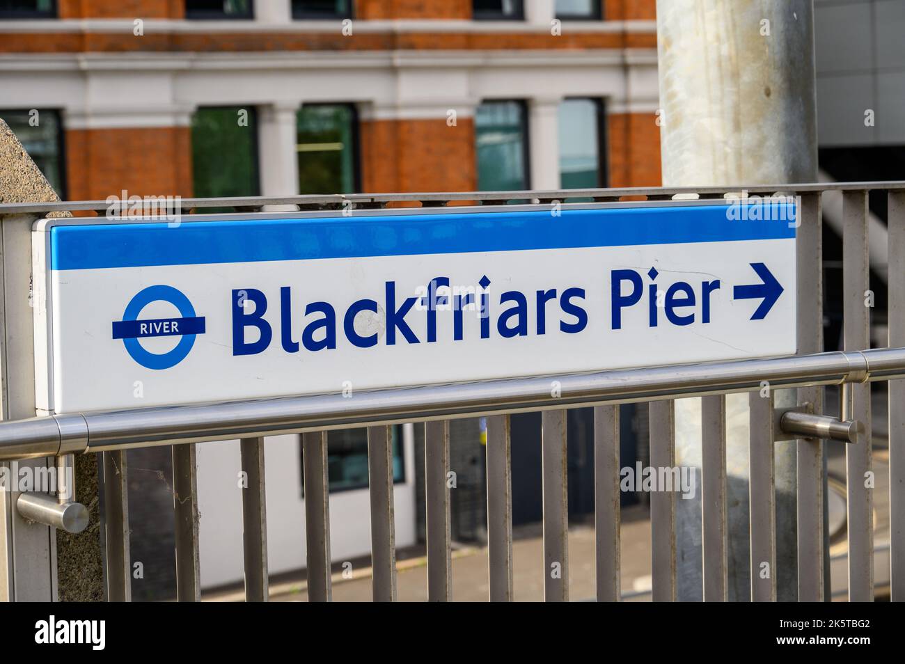 LONDON - May 21, 2022: Blackfriars Pier street sign on metal railings ...
