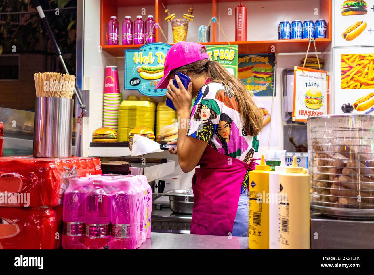 Young girl cooking at a funfair booth Stock Photo - Alamy