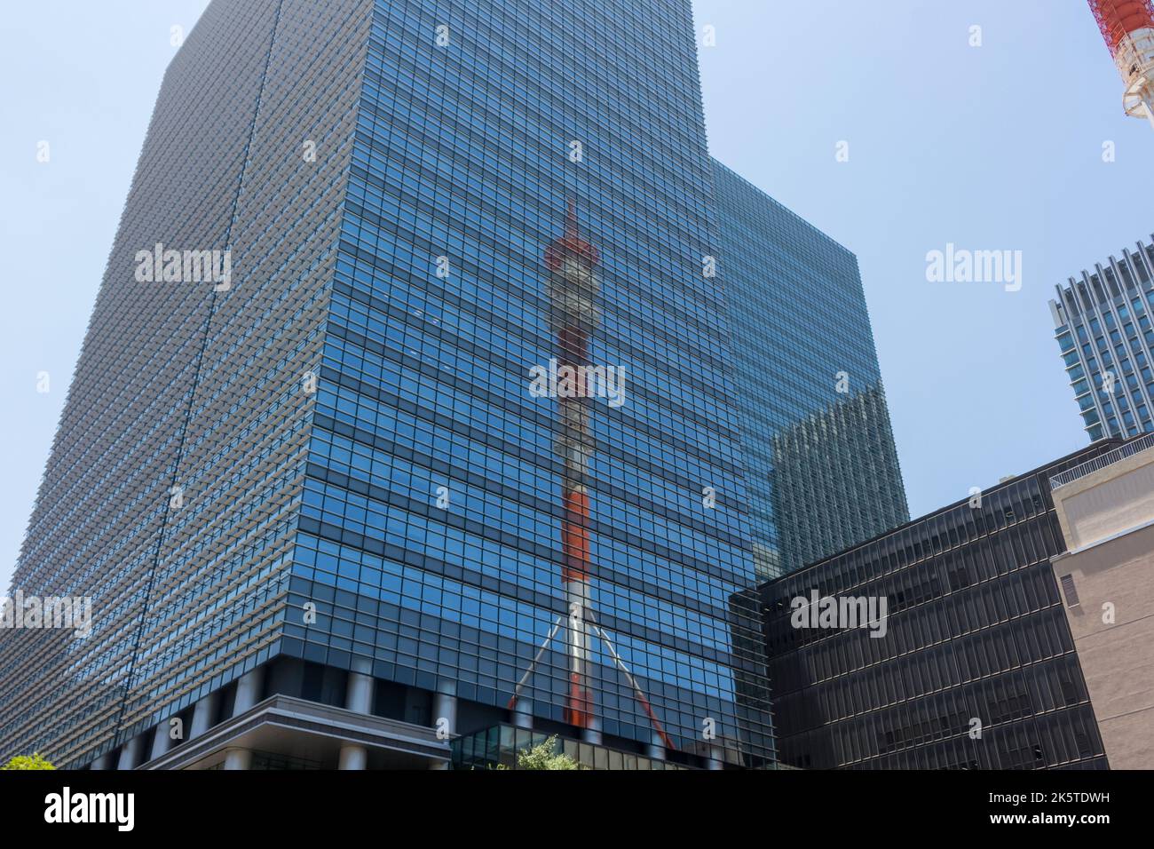 Modern high-rise building with reflection of radio mast, viewed from a ...