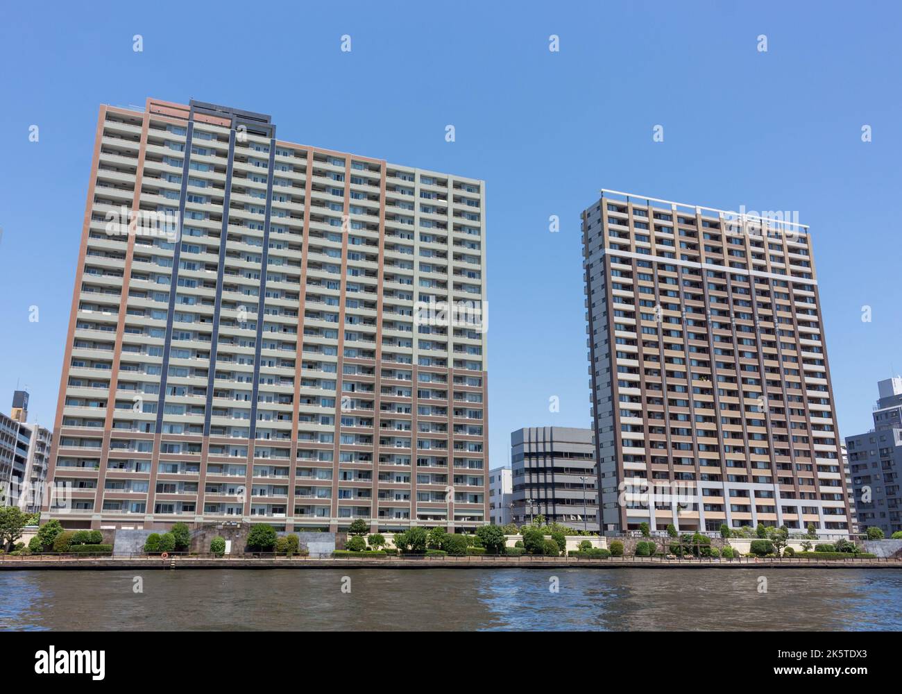 Modern high-rise apartment buildings, viewed from a boat in the Sumida ...