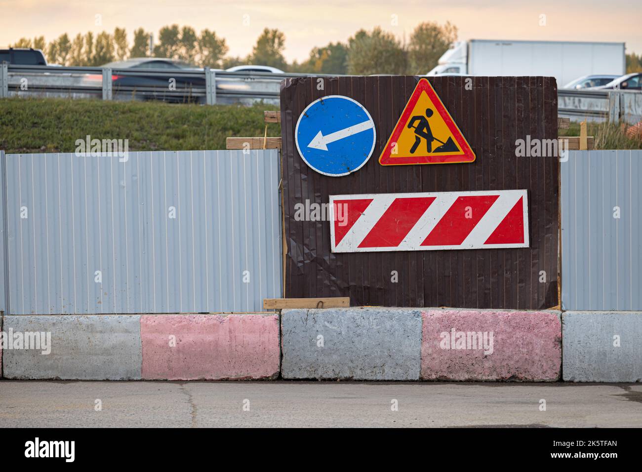 road sign indicating a detour and road works. Men at work. road detour ...