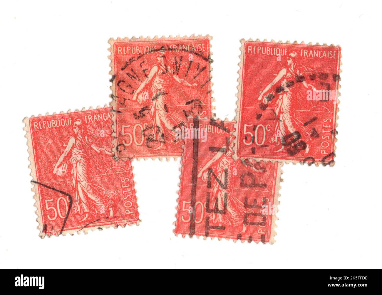 A montage of vintage postage stamps from France on a white background ...