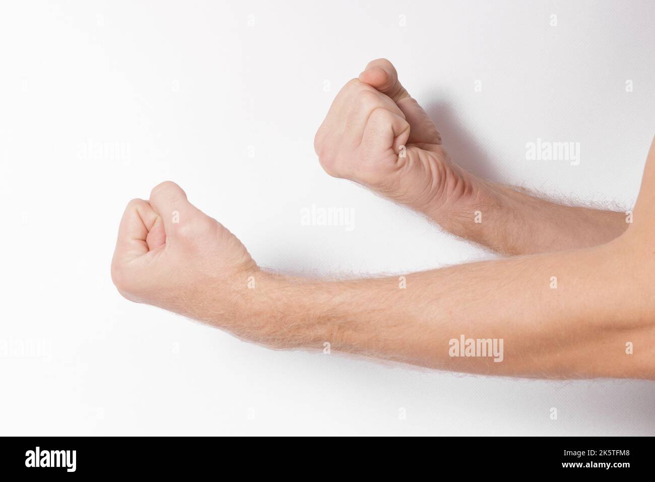 Hands clenched fists on white hi-res stock photography and images - Alamy