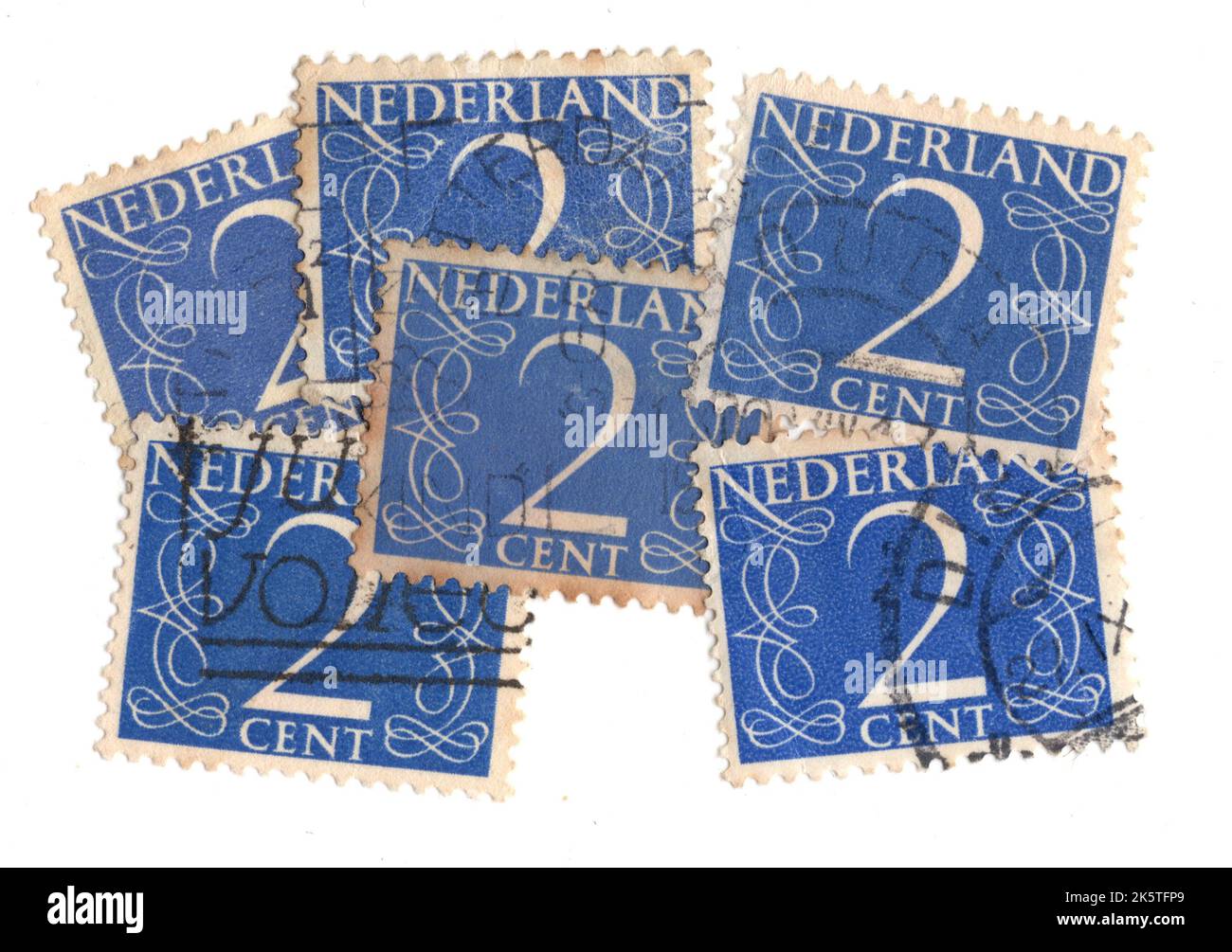 A montage of vintage postage stamps from the Netherlands on a white ...
