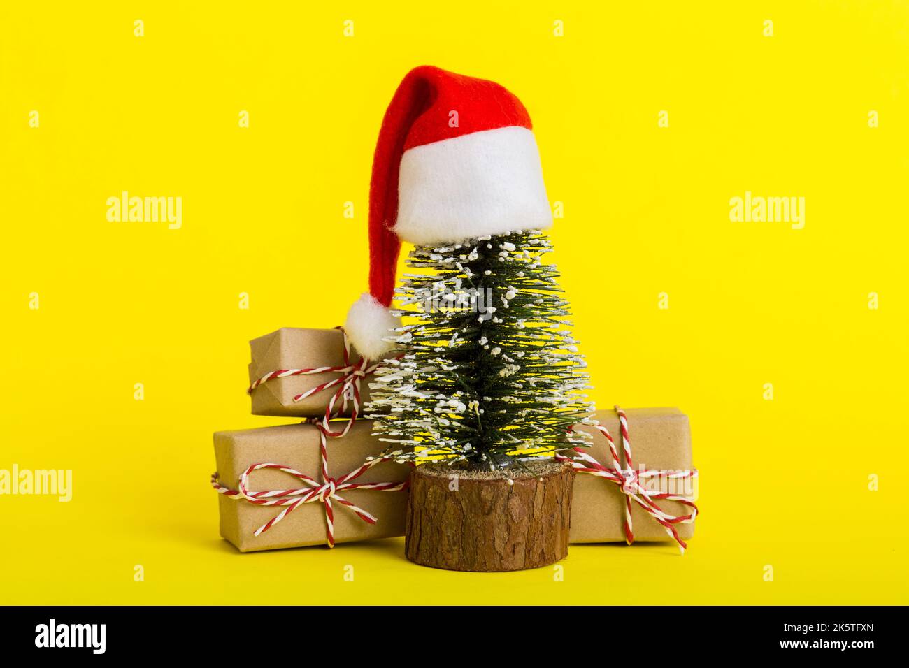 Christmas composition. Gifts, small tree, branches and craft DIY ...