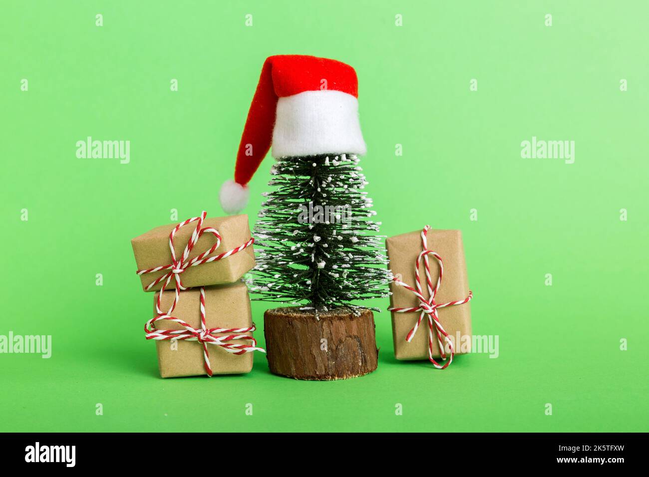 Christmas composition. Gifts, small tree, branches and craft DIY ...