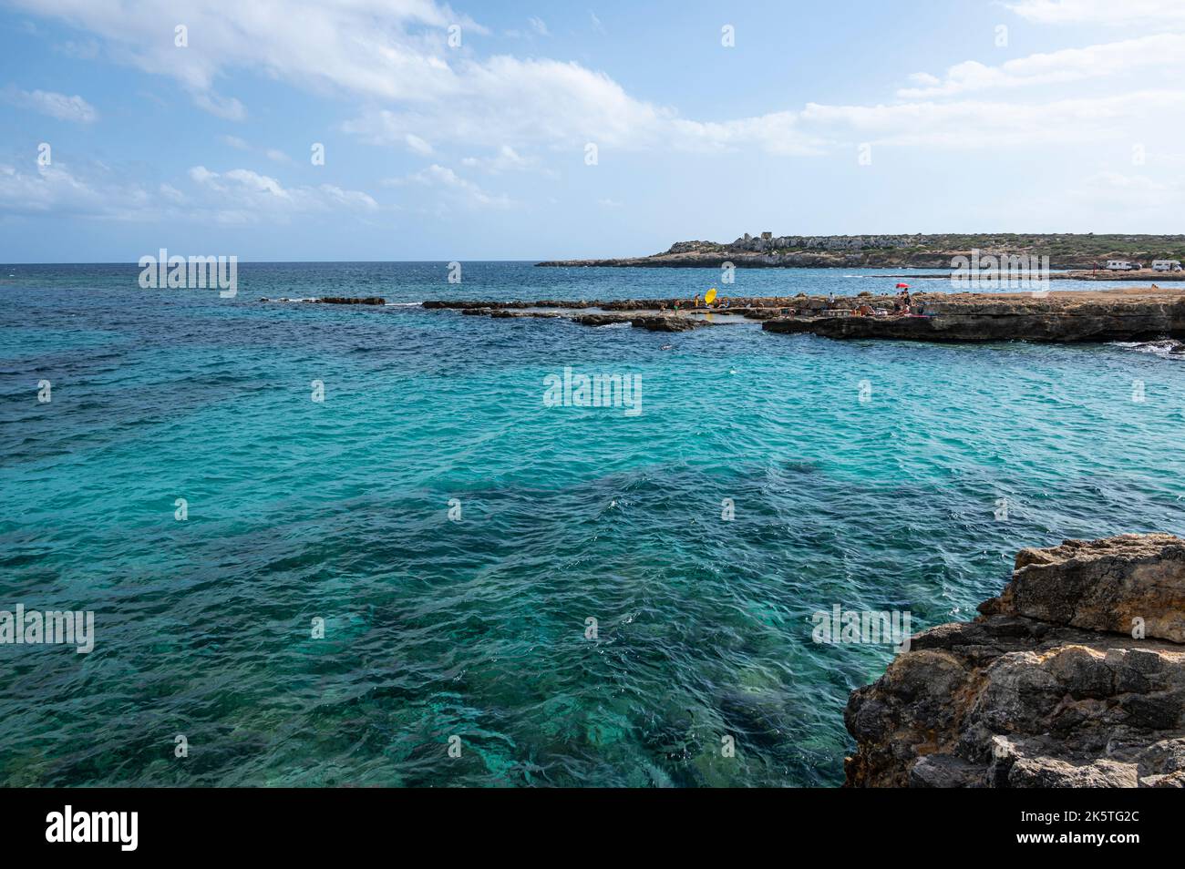 The beautiful Ognina beach in Syracuse with turquoise and green water ...
