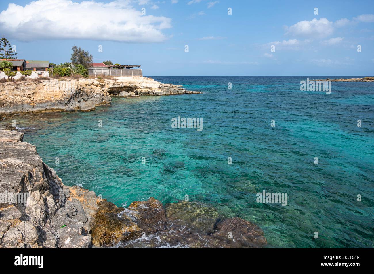 The beautiful Ognina beach in Syracuse with turquoise and green water ...