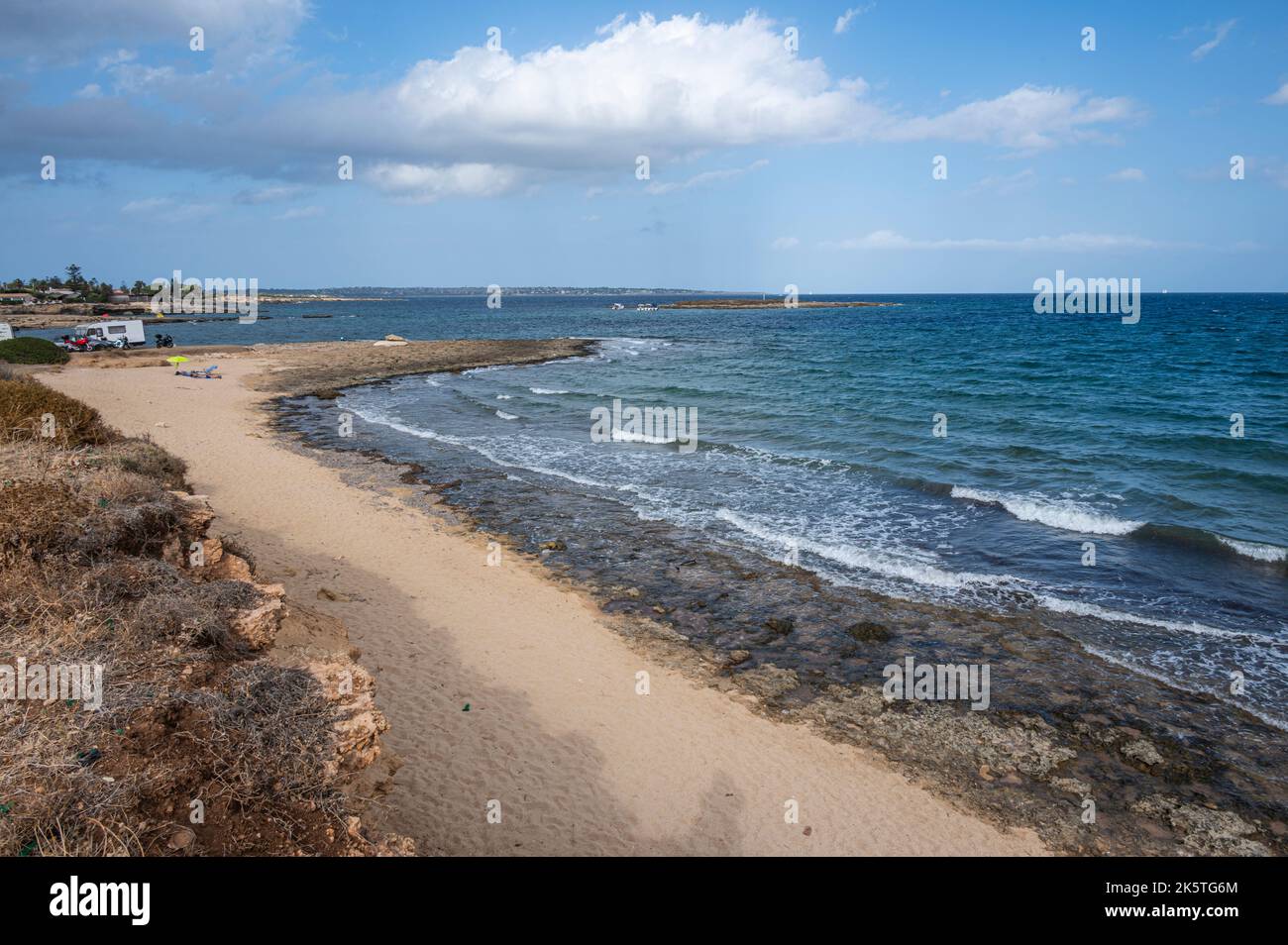 The beautiful Ognina beach in Syracuse with turquoise and green water ...