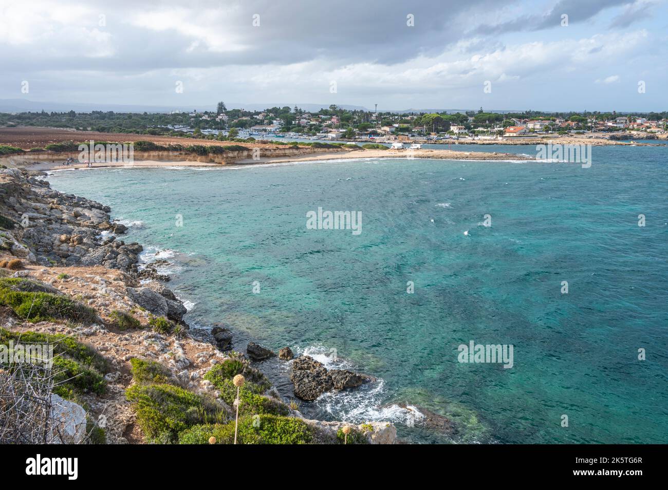 The beautiful Ognina beach in Syracuse with turquoise and green water ...