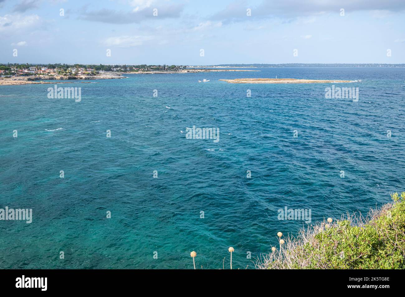 The beautiful Ognina beach in Syracuse with turquoise and green water ...