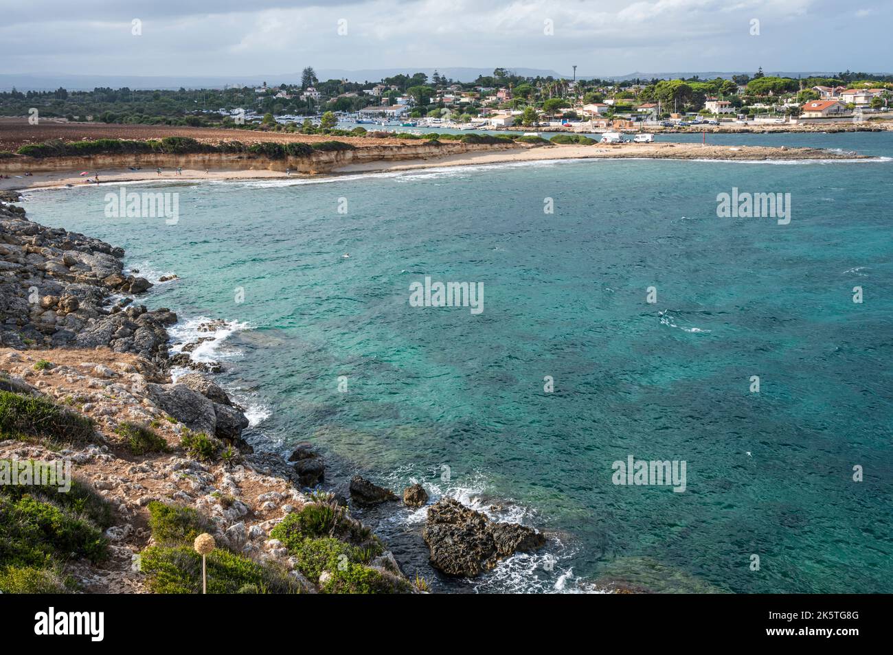 The beautiful Ognina beach in Syracuse with turquoise and green water ...