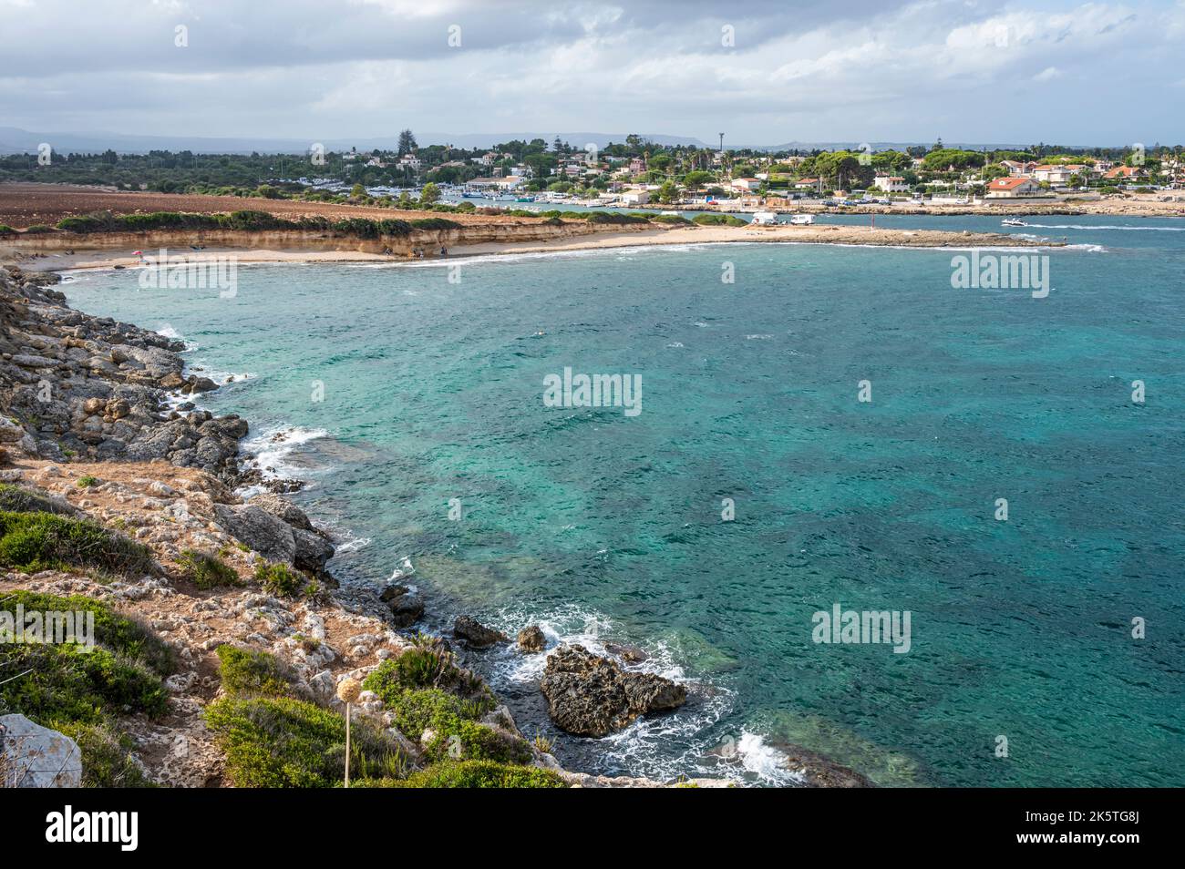 The beautiful Ognina beach in Syracuse with turquoise and green water ...