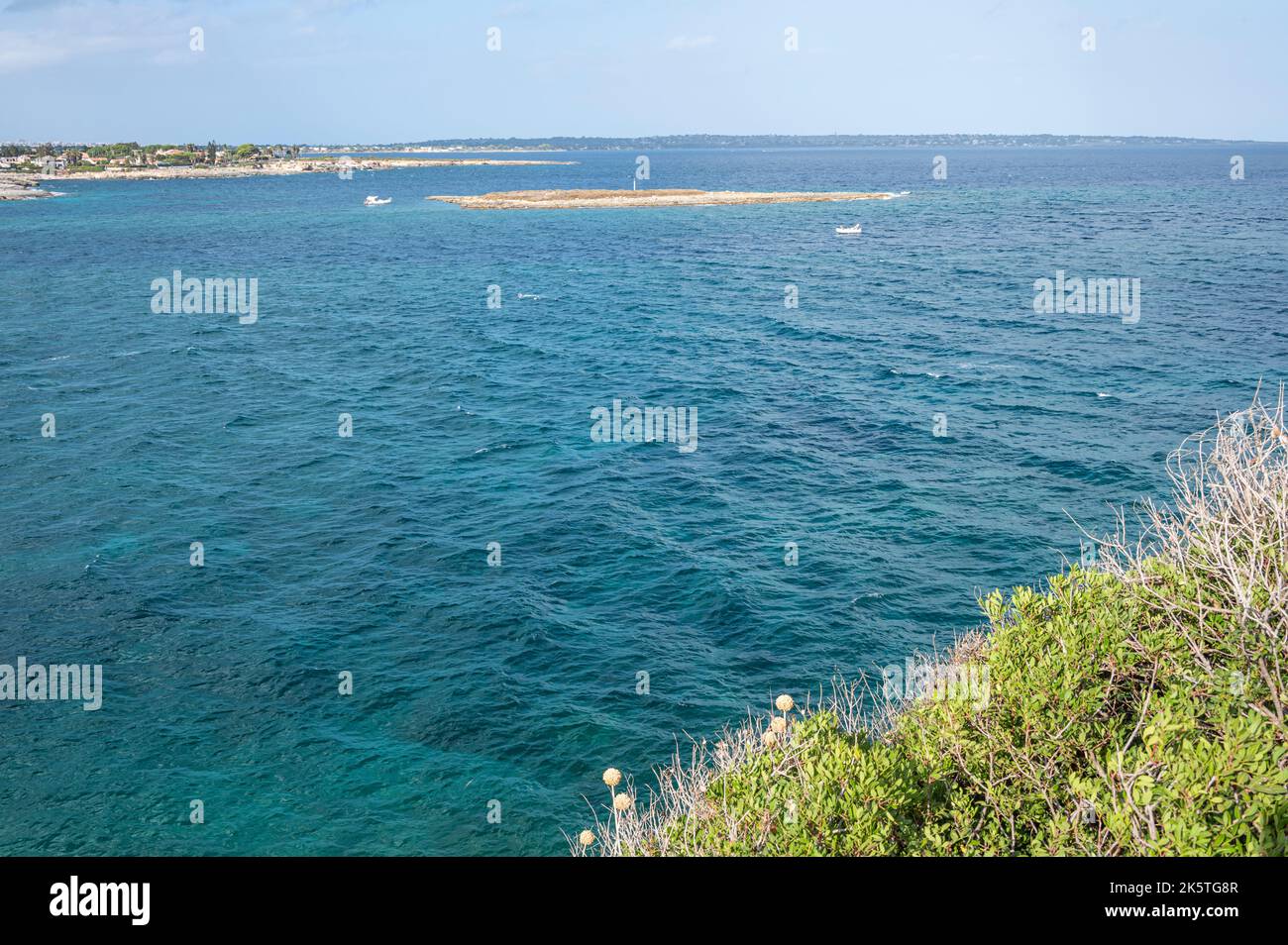 The beautiful Ognina beach in Syracuse with turquoise and green water ...