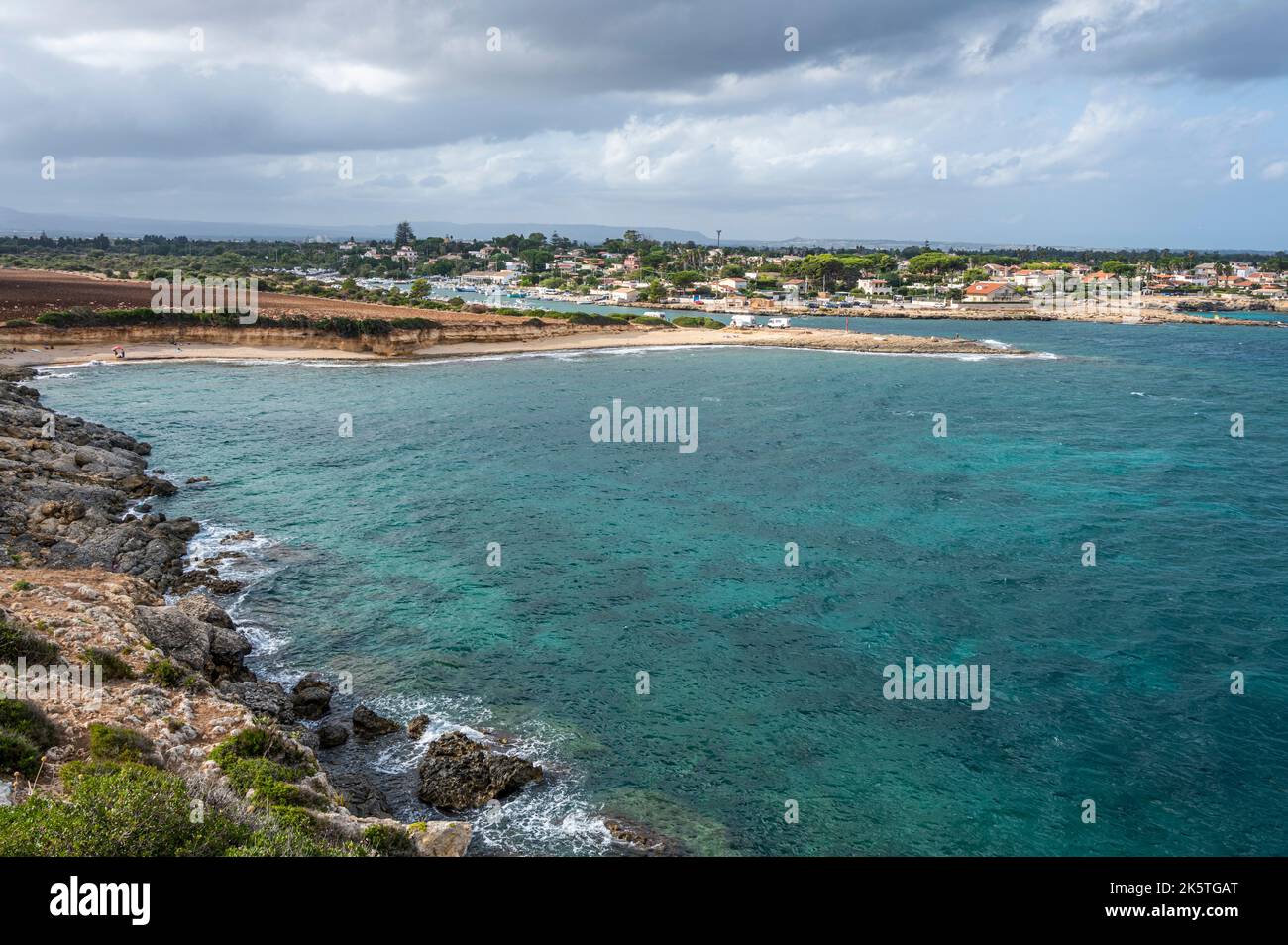 The beautiful Ognina beach in Syracuse with turquoise and green water ...