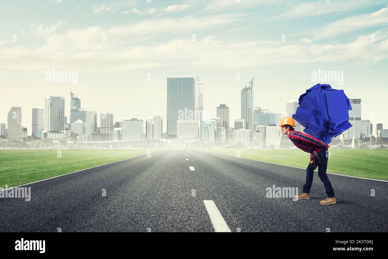 Engineer man carry load Stock Photo - Alamy