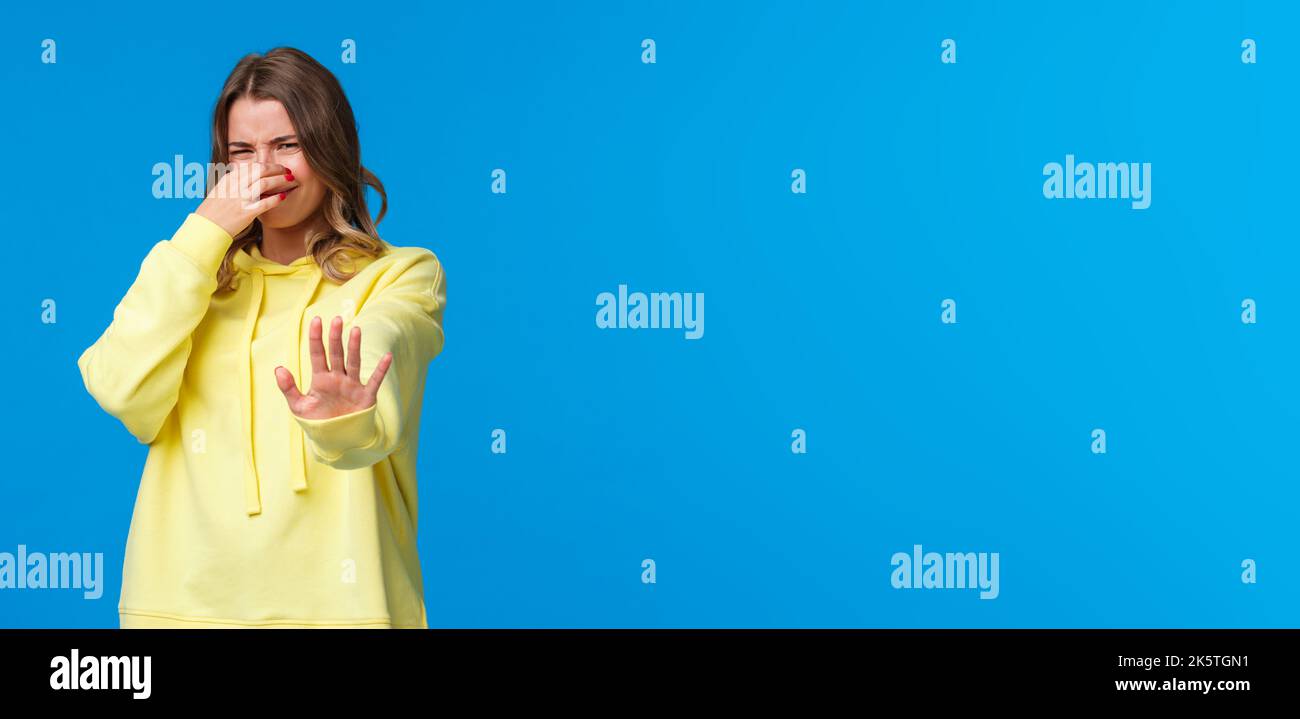 Oh gosh take this away from my face. Bothered and disturbed young blond ...