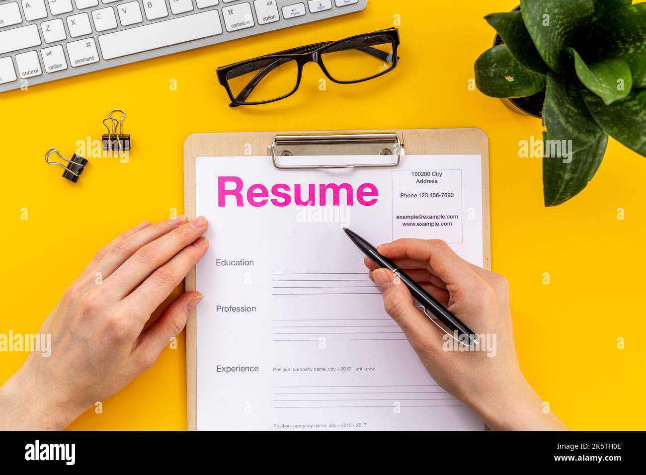 Job seeker filling resume application form on office table Stock Photo ...