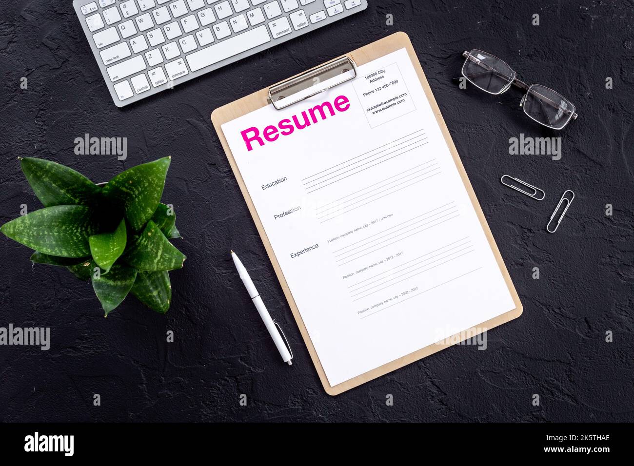 We are hiring. Resume application form on office table Stock Photo - Alamy