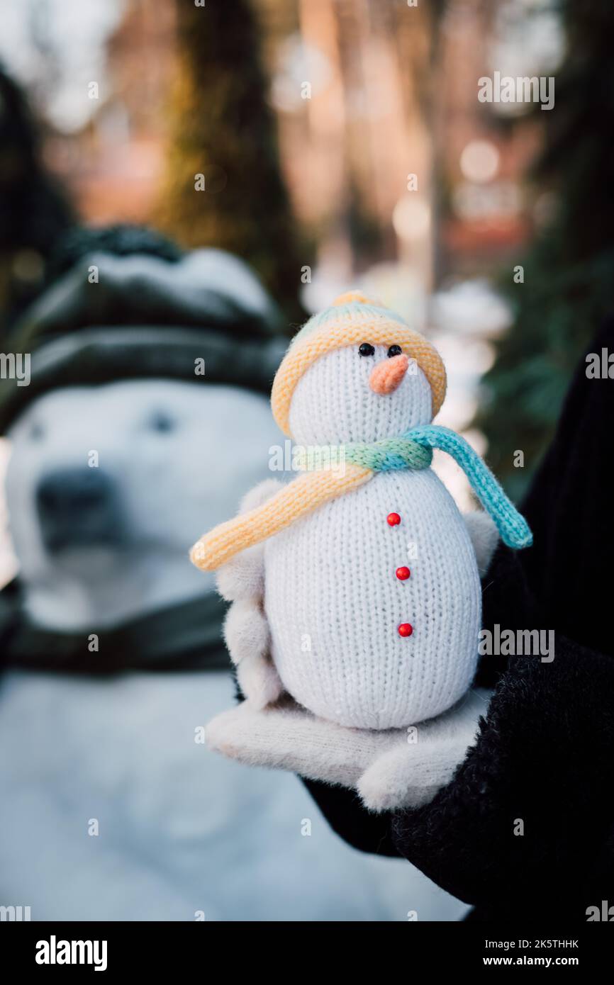 Decorative knitted snowman in women's hands Hand Made Stock Photo - Alamy