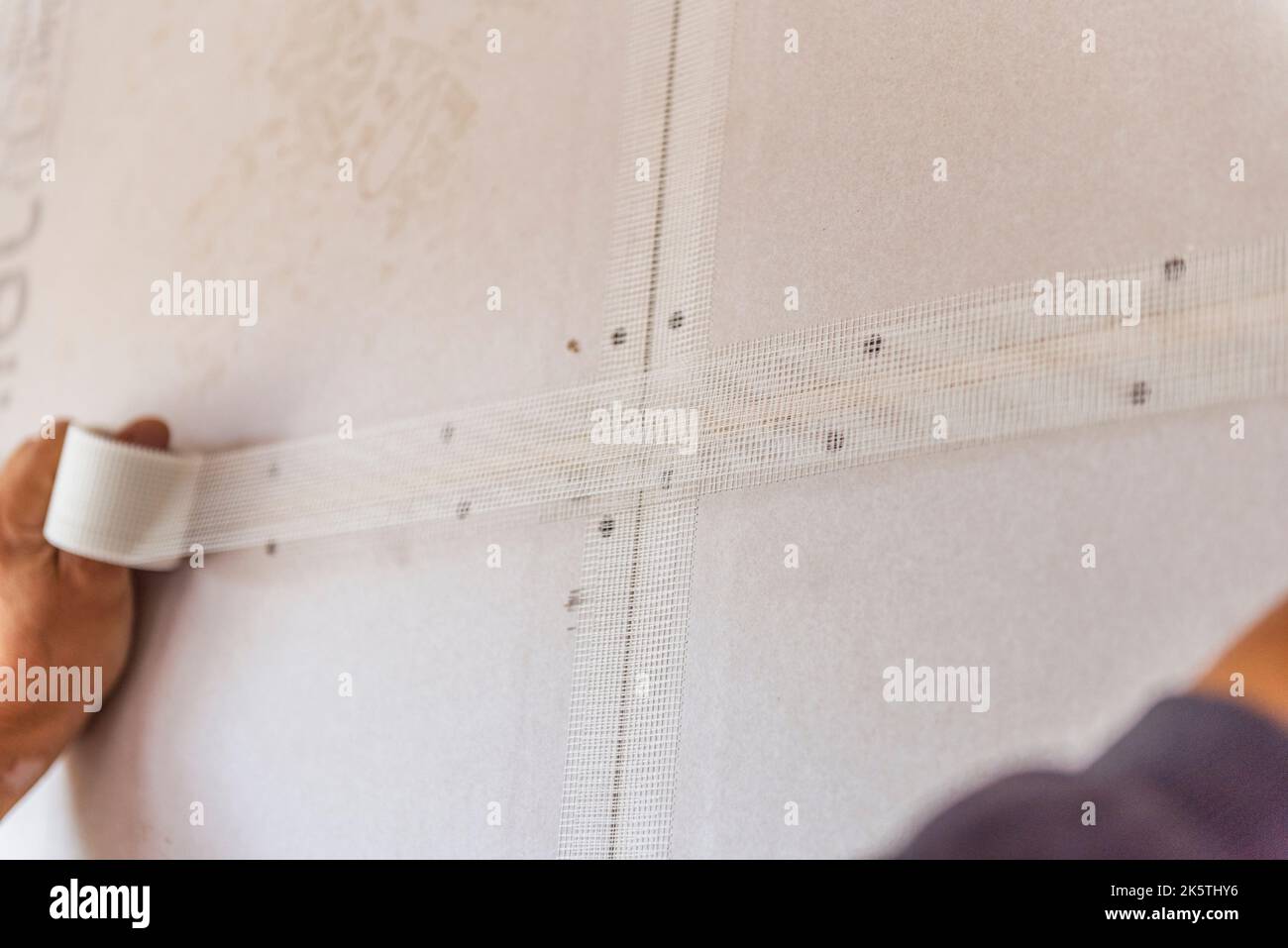 Laminated plasterboard plastering join tape Stock Photo - Alamy