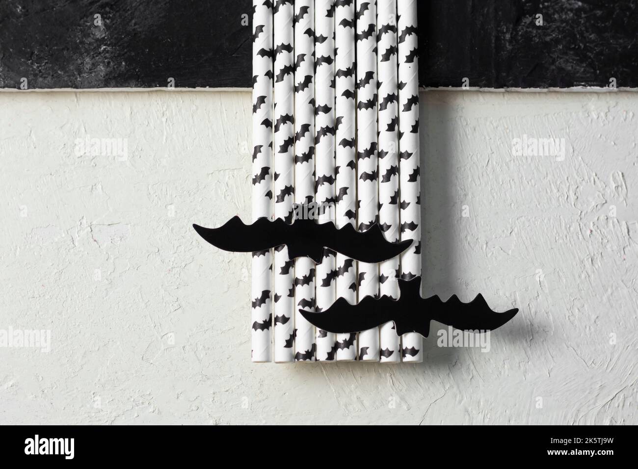 Black and white Halloween background with bat straws Stock Photo - Alamy