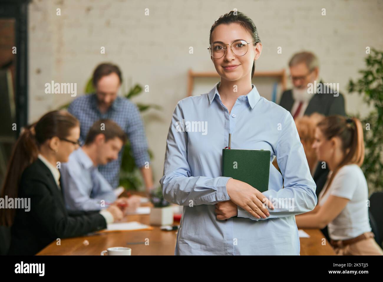 Portrait of young and successful business lady. Happy smart girl in ...