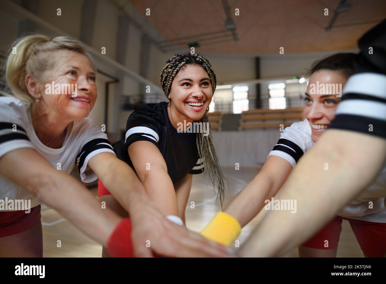 Female soccer team stacking hands hi-res stock photography and images - Alamy