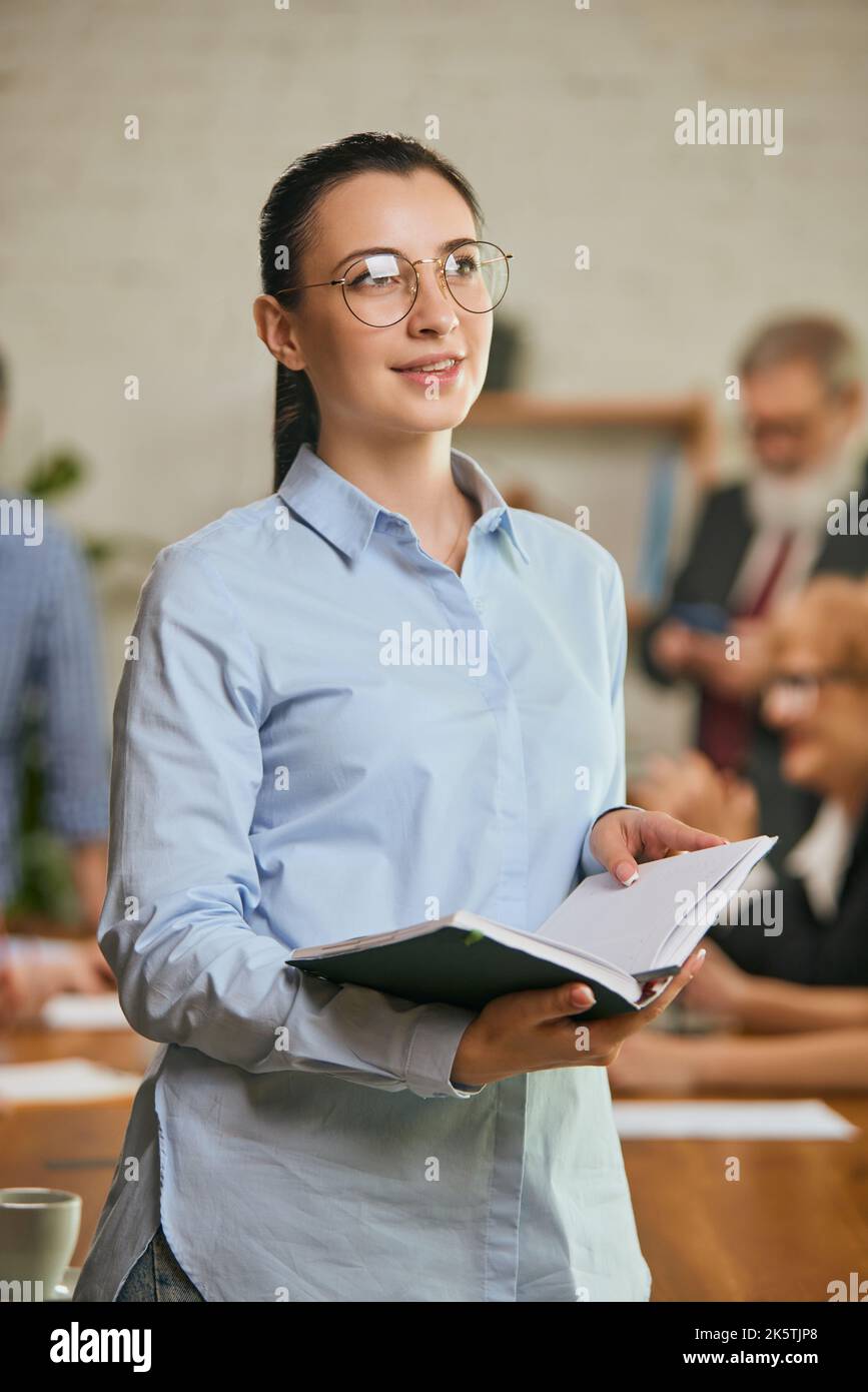Portrait of young and successful business lady. Happy smart girl in ...