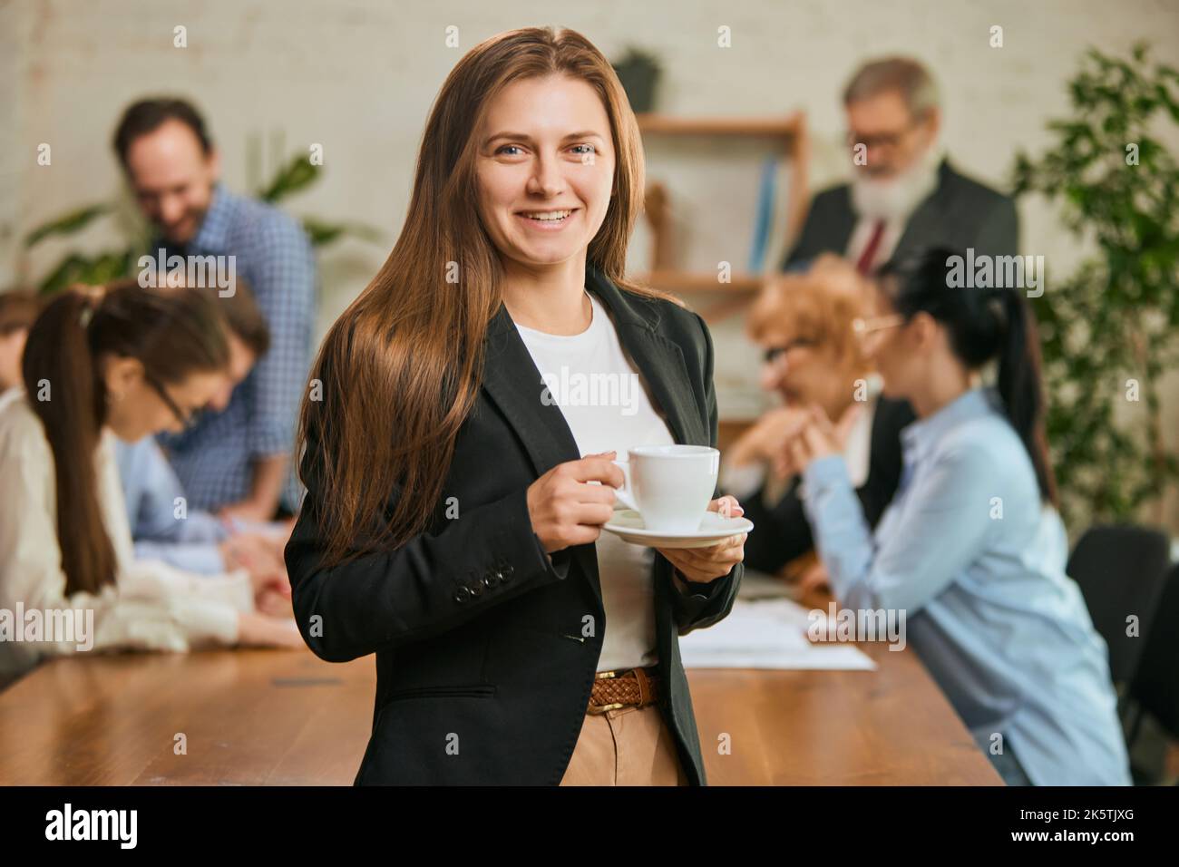 Portrait of young and successful business lady. Happy smart girl in ...